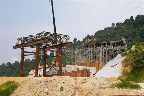 Metal Scaffolding Is Used As A Temporary Structure That Supports Works At The Construction Site