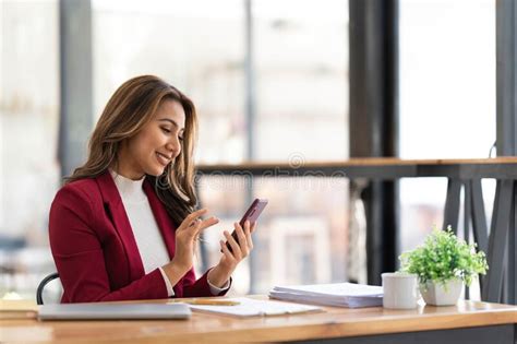Smiling Beautiful Asian Businesswoman Analyzing Chart And Graph Showing