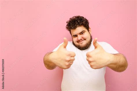 Cheerful Bearded Fat Man In White T Shirt Isolated On Pink Background