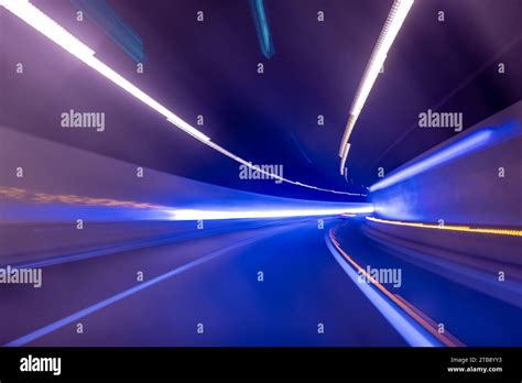 Blue And Purple Abstract High Speed Curved Movement Toward To The Future Just Around The Corner