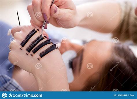 The Young Woman Getting Eyelash Extension Stock Image Image Of