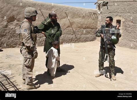 An Afghan National Army Ana Soldier With 215 Ana Corps Speaks With A