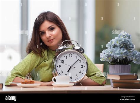 Babe With Gian Alarm Clock Preparing For Exams Stock Photo Alamy