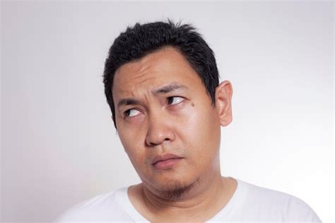 Premium Photo Photo Image Of Funny Asian Man Thinking And Looking Up