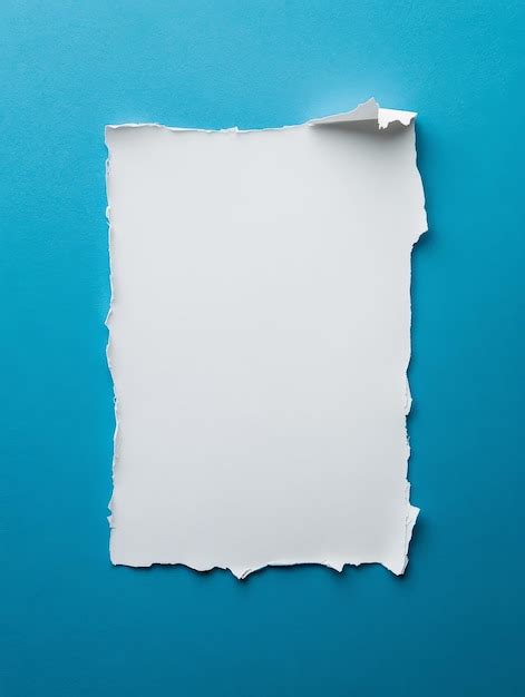 A Torn Piece Of Paper With A Blue Background Premium AI Generated Image