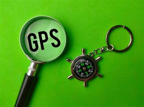 Premium Photo Top View Compass And Magnifying Glass With The Word Gps Global Positioning System