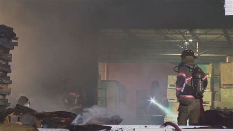 Fire Crews Battle Massive Flames At Arlington Warehouse