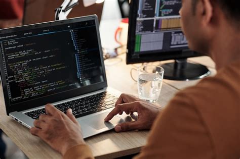 Premium Photo Software Developer Coding On Laptop