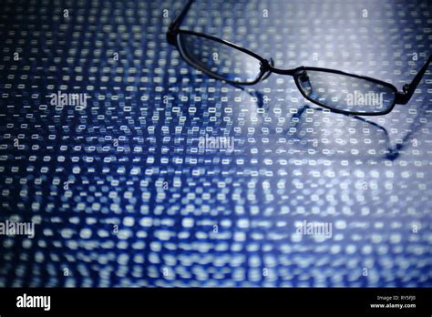 Big Data Analysis Blue Binary Code On Led Panel With Black Background And Glasses Placed Over