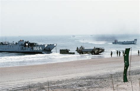 A LARC Light Amphibious Resupply Cargo Amphibious Cargo Carrier Assists An M Ambulance