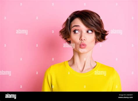 Photo Portrait Of Curious Girl Looking Empty Space With Pouted Lips