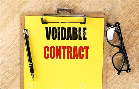 Clipboard With Voidable Contract Text Black Pen And Glasses On A
