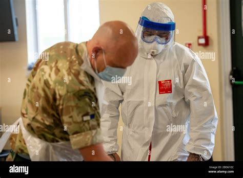 Members Of The British Army Learn How To Apply Ppe During Training To