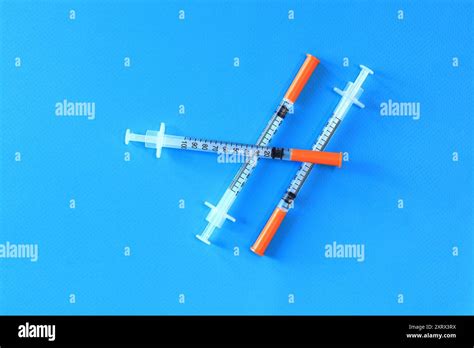 Insulin Syringes On A Blue Background Diabetes Treatment Medicine And