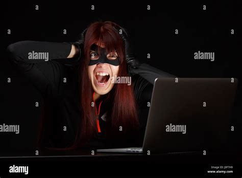 Brunette Hacker In Black Mask Screaming At Computer Stock Photo Alamy