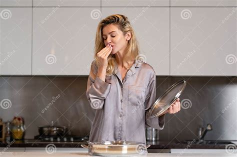 Woman Cooking In A Kitchen Taste And Delicious Housewife On Morning