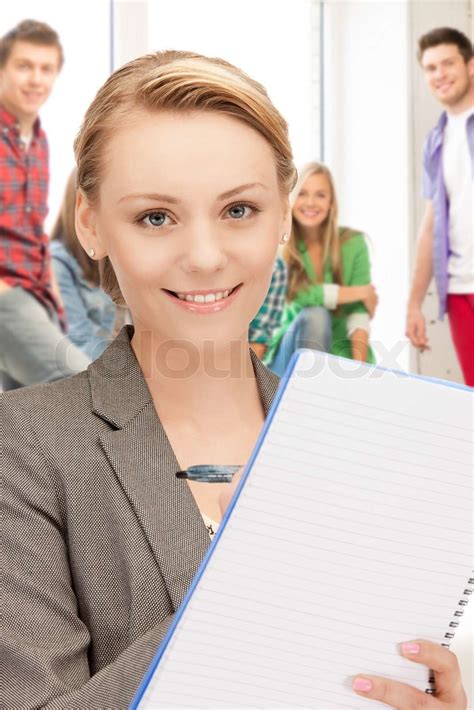 Lehrer mit großen Notizblock in der Schule Stock Bild Colourbox