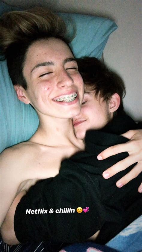 A Young Man And Woman Cuddle Together In Bed With The Caption Texting