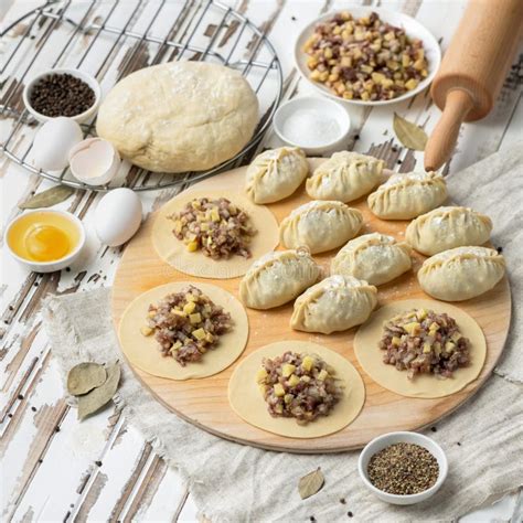 Homemade Food Preparation Raw Meat Filling On Rolling Dough Circles