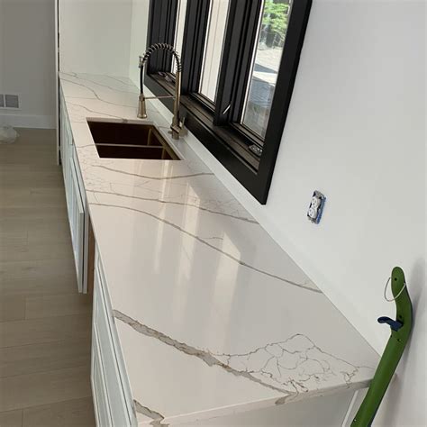 Featured Project New Calacatta Laza Gold Quartz Countertops In New