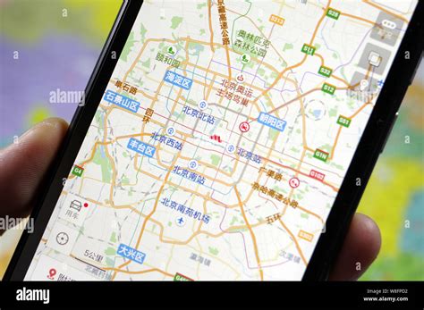 a chinese man uses the baidu map app on his smartphone in jinan city east china s shandong