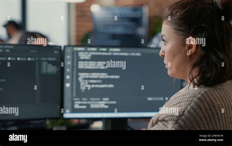 Over Shoulder View Of Focused Database Designer Writing Code Looking At