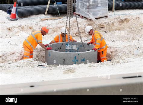 Motorway Construction Workers Installing An Fp Mccann Precast Concrete