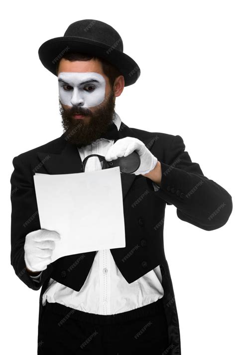 Free Photo Man With A Face Mime Reading Through Magnifying Glass