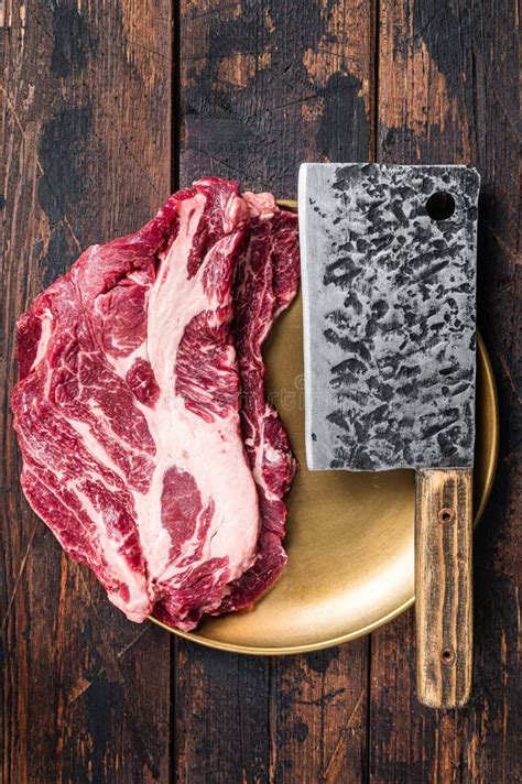Raw Marbled Meat Steak On Butcher Table Uncooked Beef Chuck Eye Roll