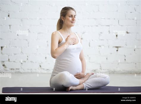 Pregnancy Yoga And Fitness Concept Portrait Of Young Pregnant Yoga