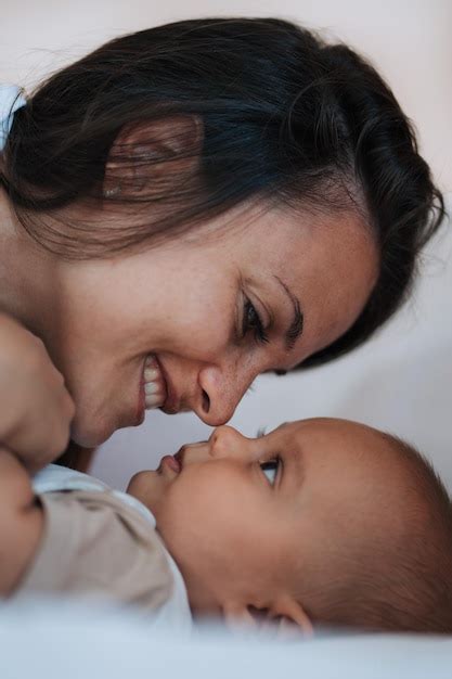 Premium Photo Happy Moments Of Mom And Son Playing And Cuddling In