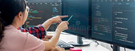 Professional Programer Looking Computer Desktop With Coding Program