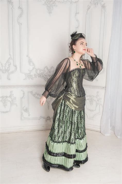 Sad Crying Woman Wearing Green Medieval Vintage Victorian Style Dress