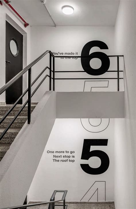 Wayfinding Signage Design With Black Numbers On White Walls Interior