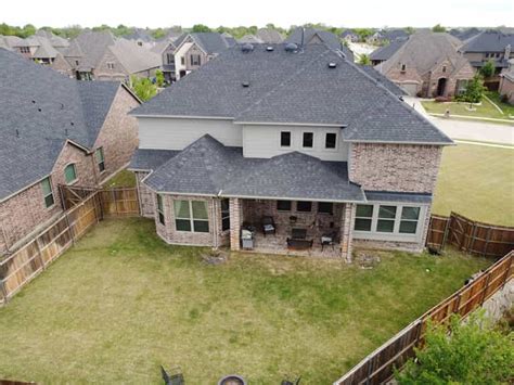 Rowlett TX Custom Gable Roof Covered Patio With A Retractable Screen Is