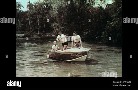 1960s Man Jumps Out Of Boat Alligator Under Water Man Wrestles