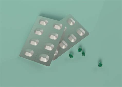 A Group Of Pills Flying Through The Air Photo Capsule Image On Unsplash