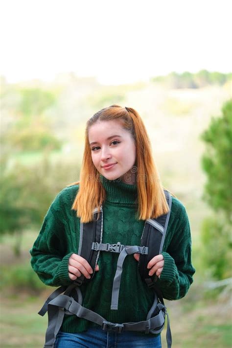 Smiley Hiker Redhead Young Woman Posing Looking At Camera Wearing A