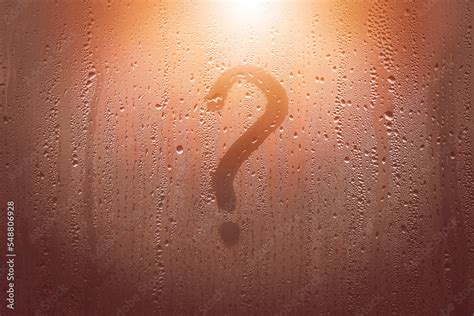 A Question Mark On A Fogged Window A Question Mark Drawn On A Window