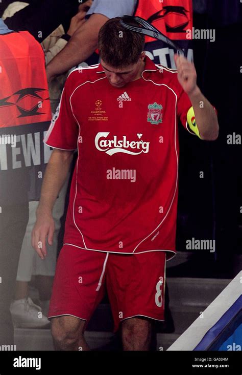 Liverpool S Steven Gerrard Looks Dejected As He Takes Off His Runners