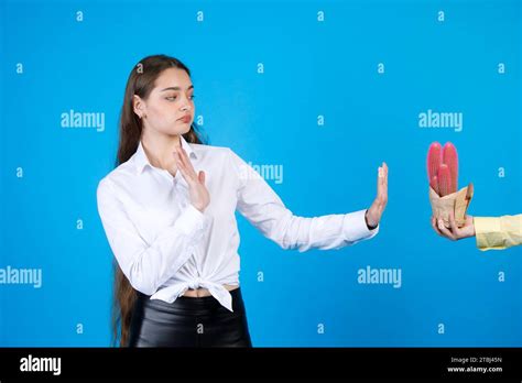 Vexed Scared Girl Making Stop Gesture For Anonymous Hand Presenting