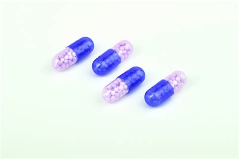 약 약입니다 정제입니다 Capsulepharmaceutical의 약 파란색의 더미의 클로즈업 흰색 노란색 및 녹색 정제캡슐 알