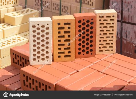 Perforated Bricks Of Different Colors And Shapes Of Holes Stock Photo