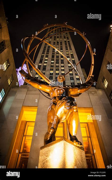The Historic Atlas Statue In Rockefeller Center Stands In Front O F The