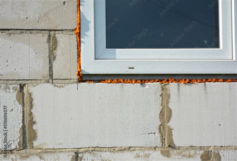 Foto Stock How To Install PVC Window With Insulation For House Energy Saving Adobe Stock