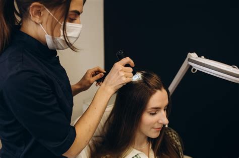 Premium Photo Doctor Trichologist Examines Woman Patients Hairs