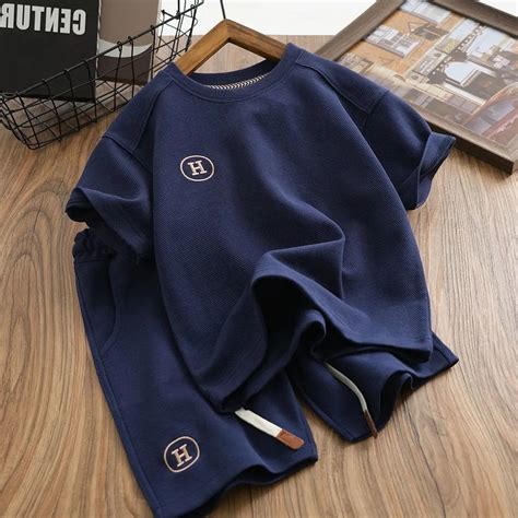 กางเกงขาสั ้ นแขนสั ้ นเด ็ กชายฤดูร ้ อนสําหรับเด ็ กกลางและใหญ ่ ชุดสูทสองชิ ้ นสไตล ์ เกาหลี