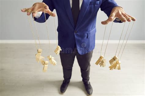 Man Manipulating Wooden Marionettes Or Puppets Stock Photo Image Of