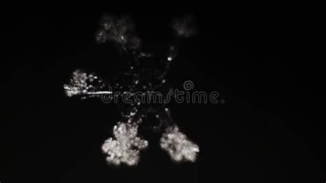 the sharp edges of icicles hanging from a rooftop illuminated by the