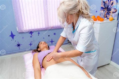 Top View Of Hands Massaging Female Abdomentherapist Applying Pressure